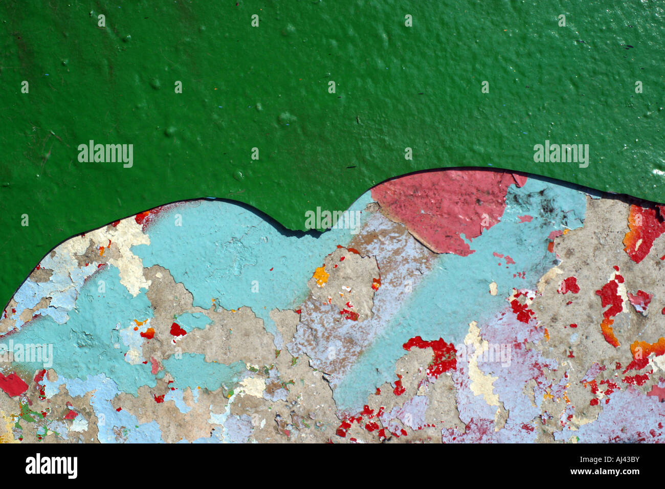 Close up of old layered graffiti tag paint work on a textured wall ...