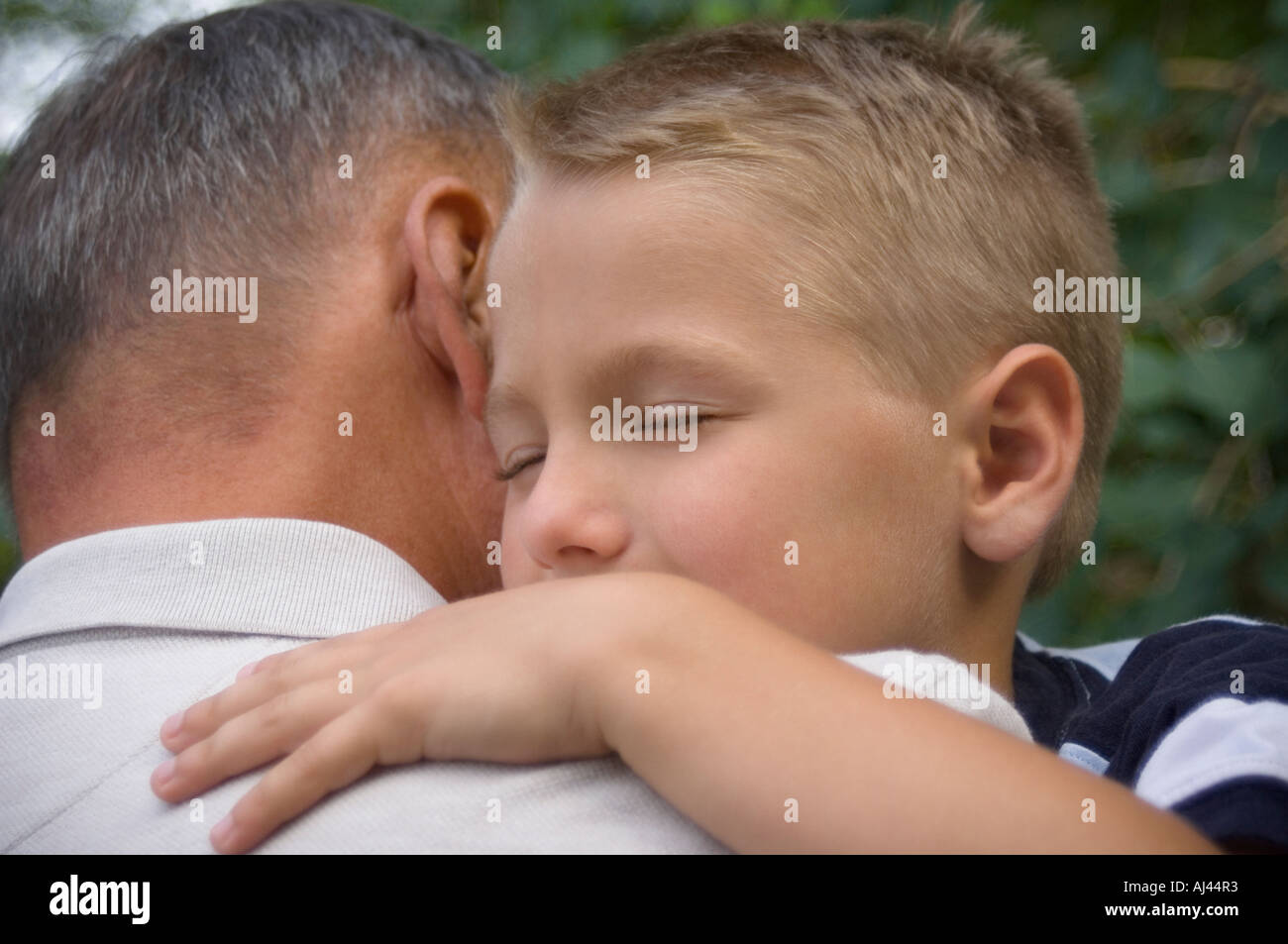 Grandson hugging Grandpa Stock Photo - Alamy
