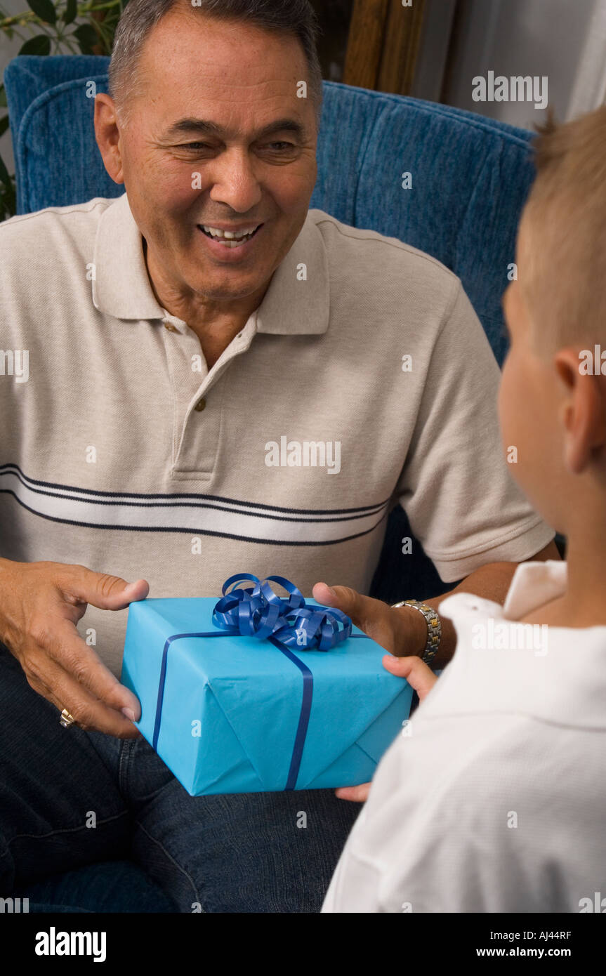 Grandson giving Grandpa a gift Stock Photo - Alamy