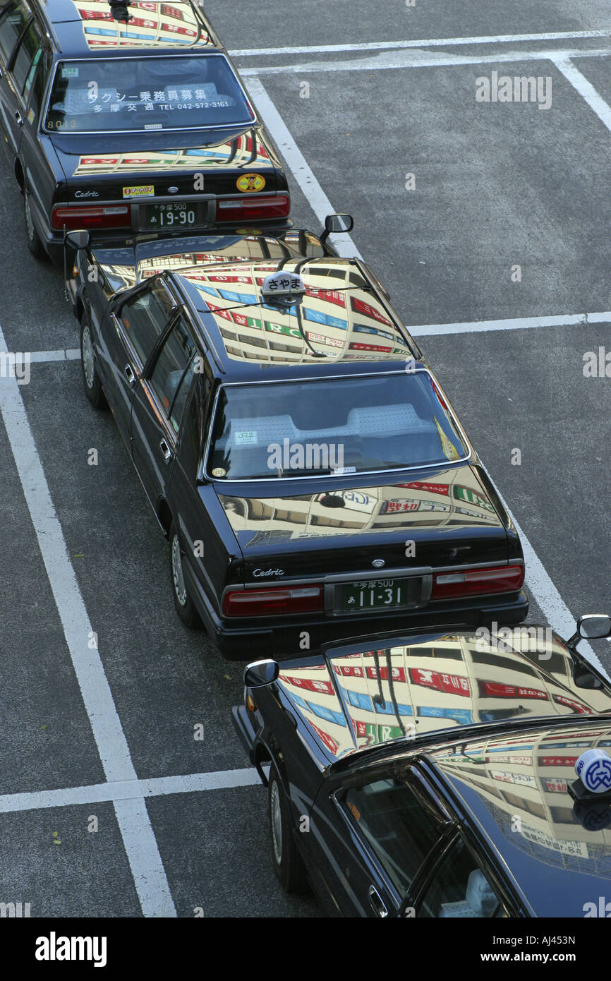 Taxis at waiting bay reflect cityscape of Tachikawa Tokyo Japan Stock ...