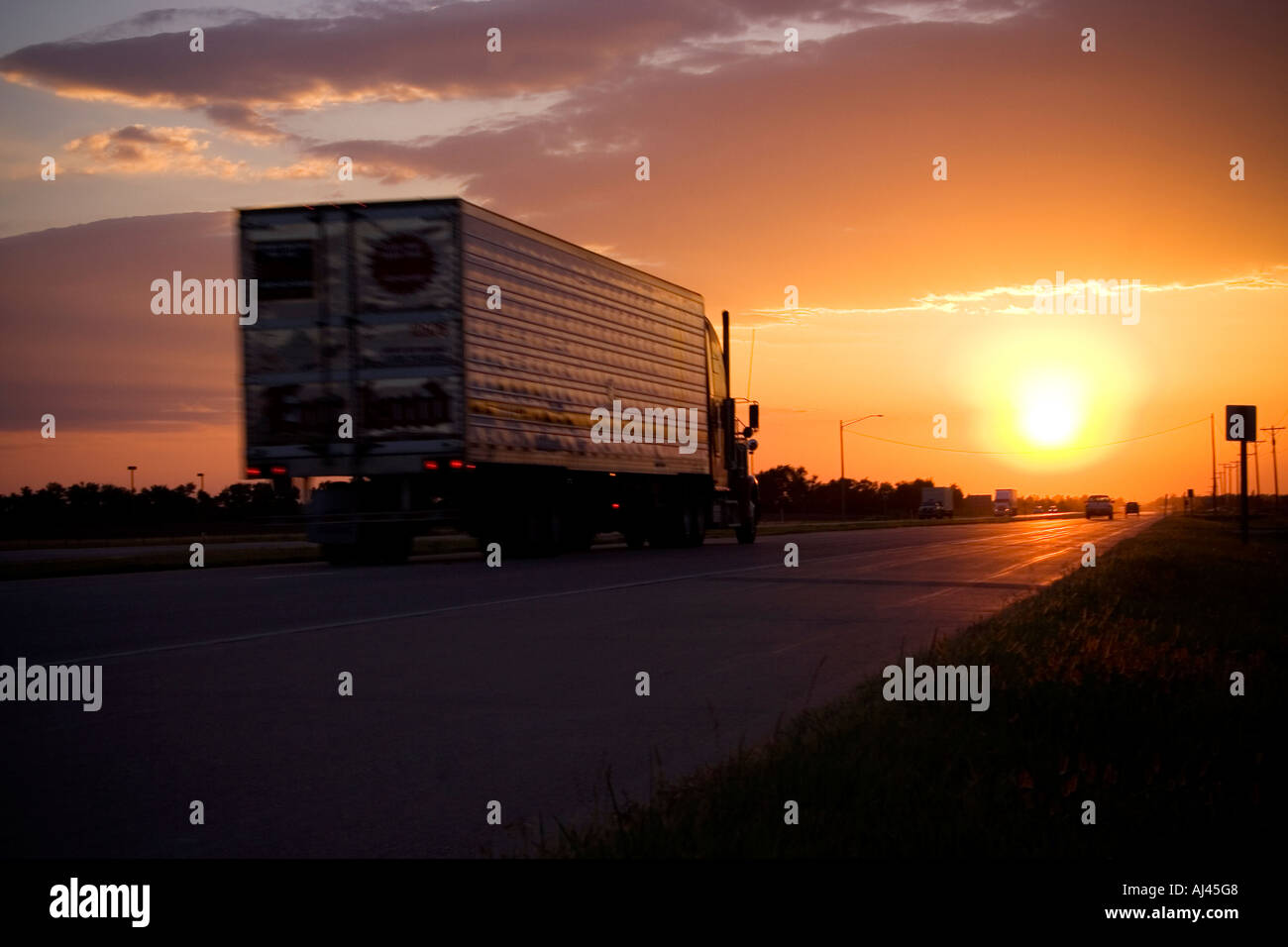 Semi truck at sunset Stock Photo - Alamy