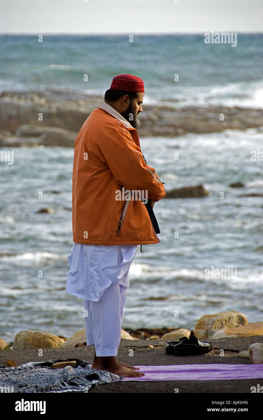 Muslim praying at Cape of Good Hope South Africa Stock Photo - Alamy