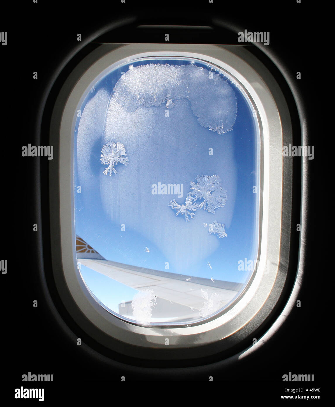 The freezing atmosphere outside the airplane window Stock Photo - Alamy