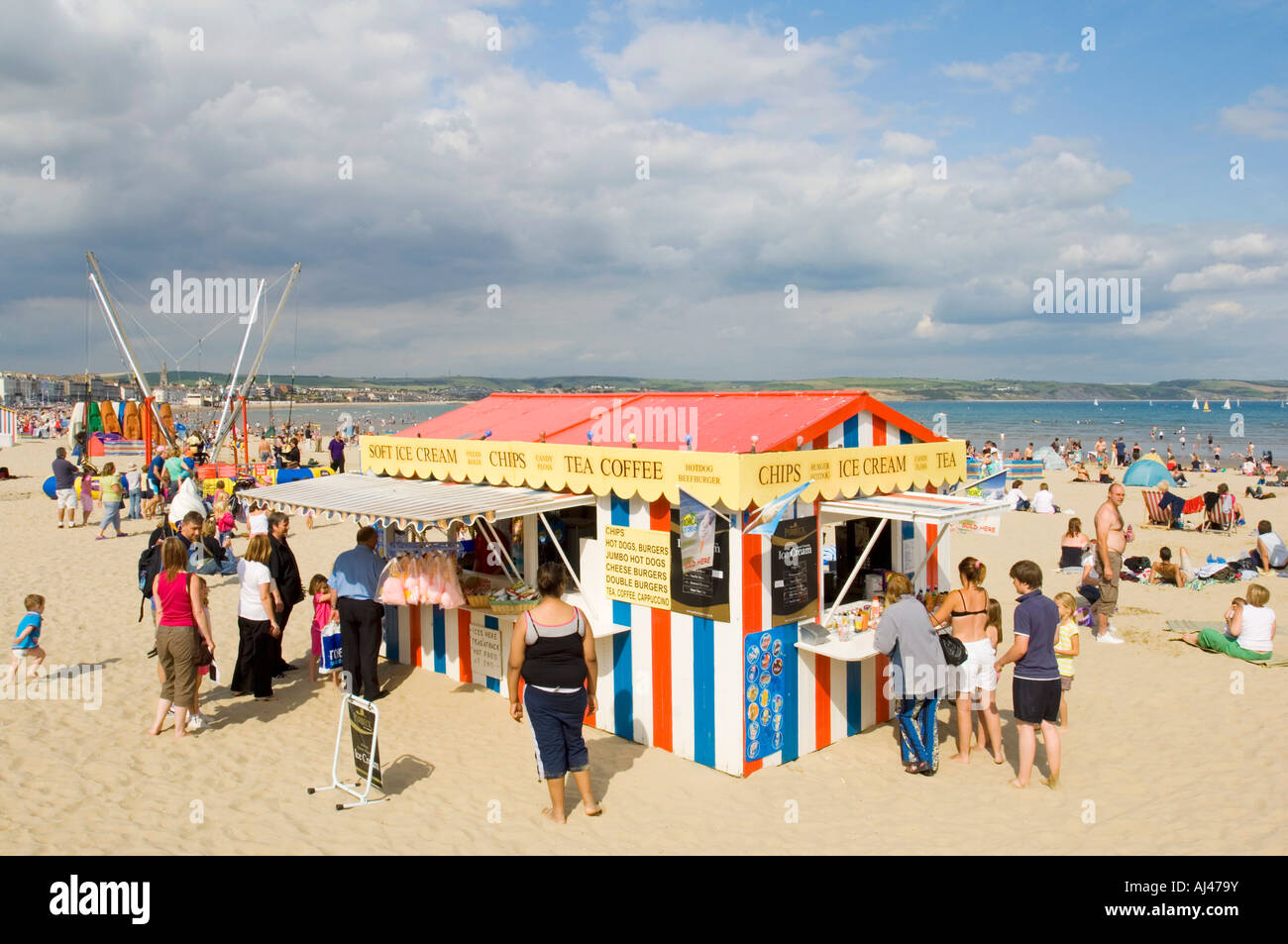 A quick food stall selling unhealthy food on a crowded beach at ...