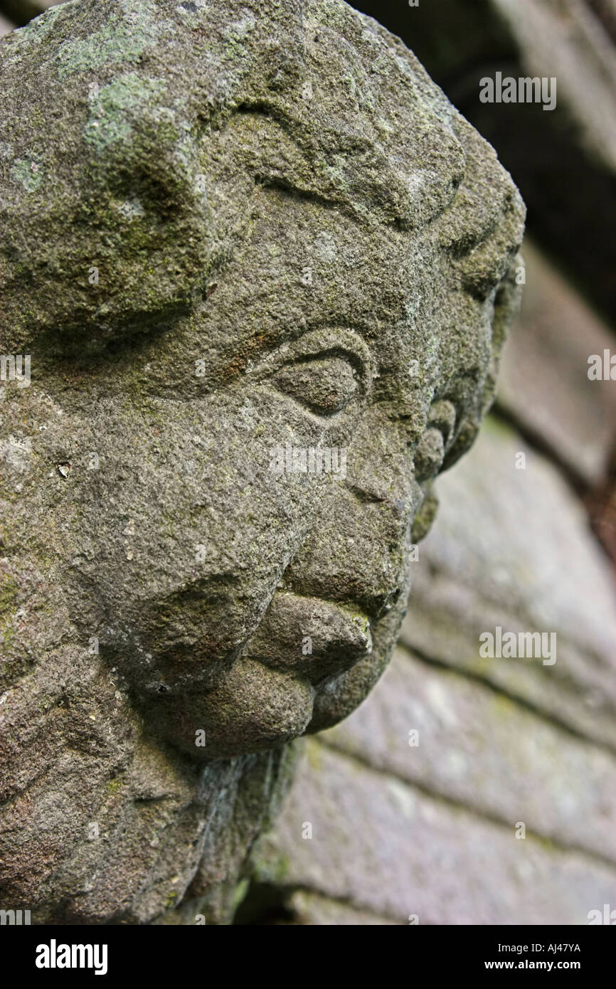 Face of child cherub stone sculpture on church wall Stock Photo - Alamy
