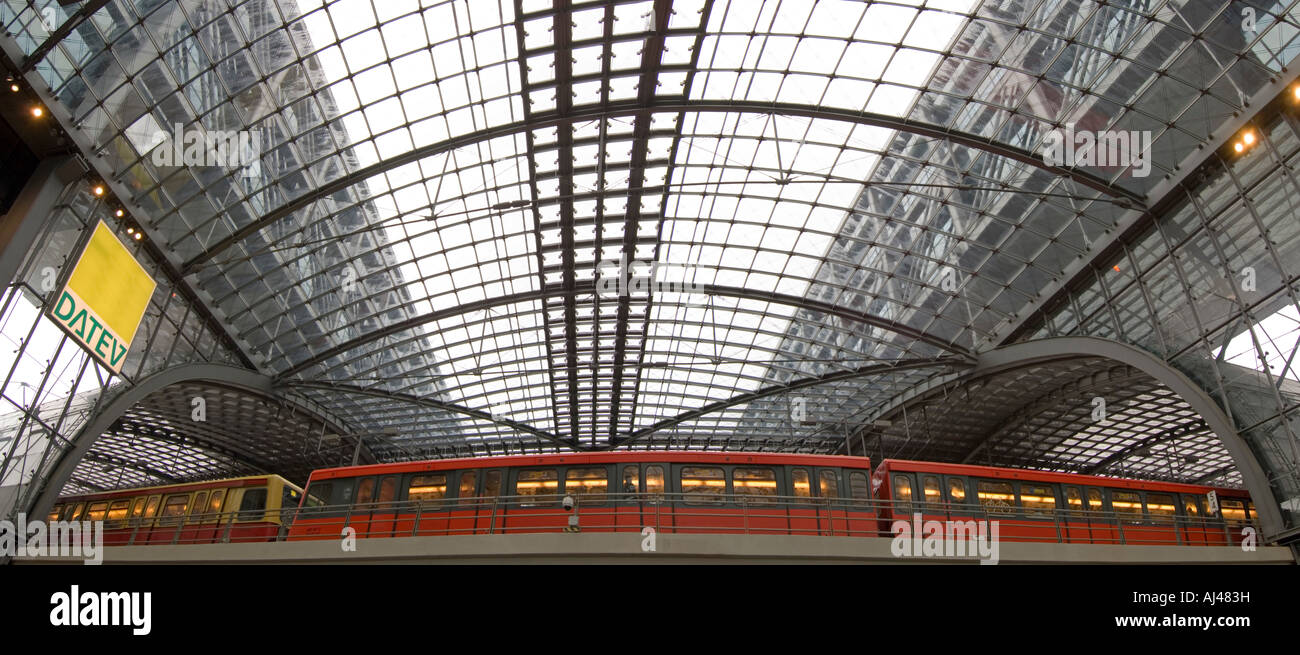 A 2 picture stitch panoramic of a local train pulling away from the ...