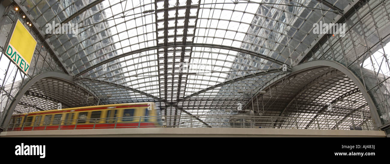 A 3 picture stitch panoramic of a local train pulling away from the ...