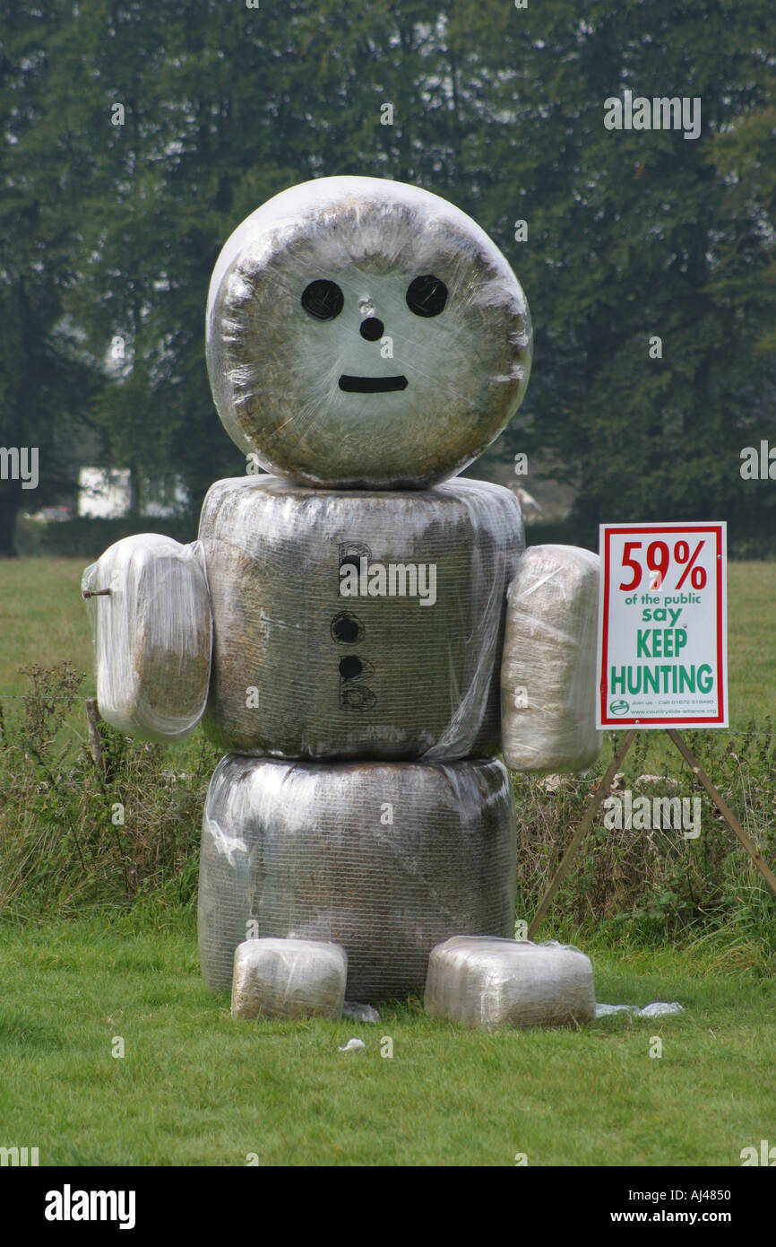 Man figure made of straw bales with placard supporting fox hunting ...