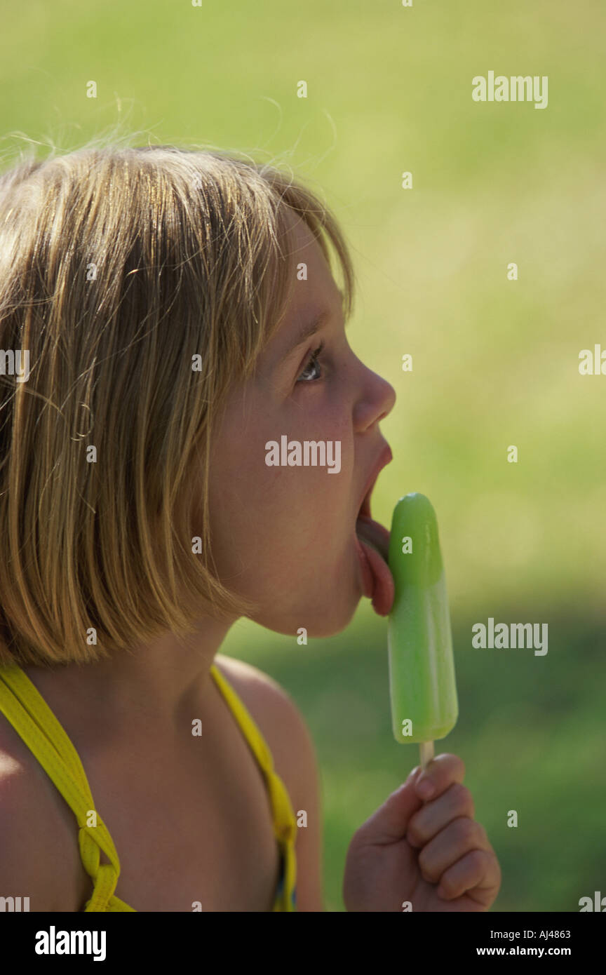 Girl licking popsicle hi-res stock photography and images - Alamy