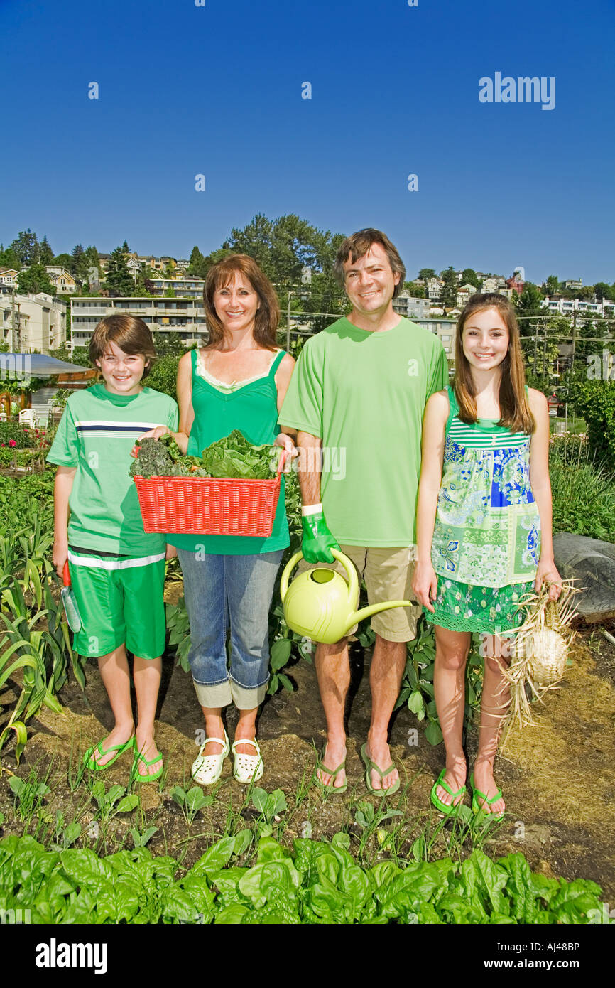 Family in vegetable garden Stock Photo - Alamy