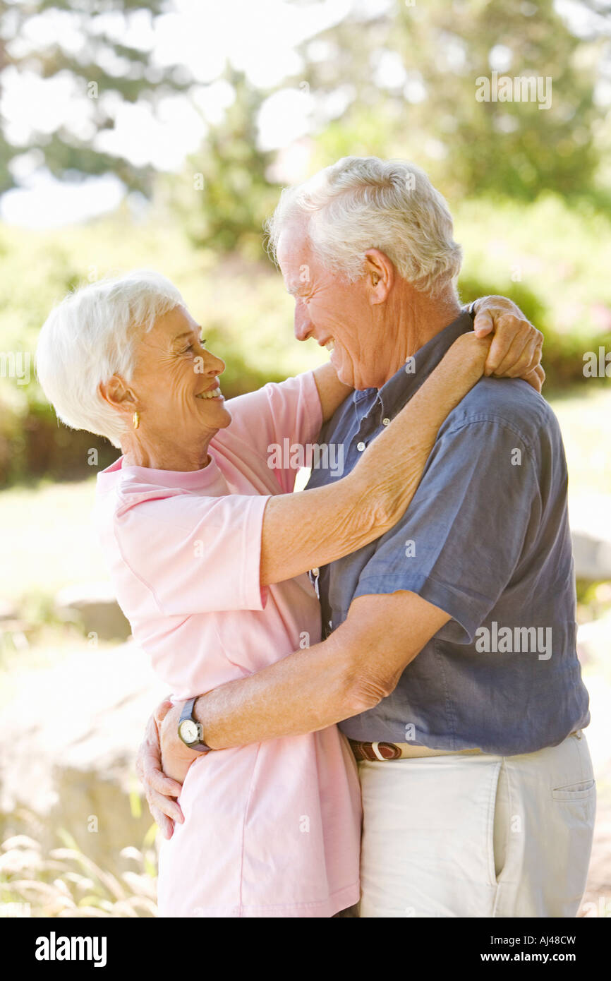 Senior couple hugging Stock Photo - Alamy