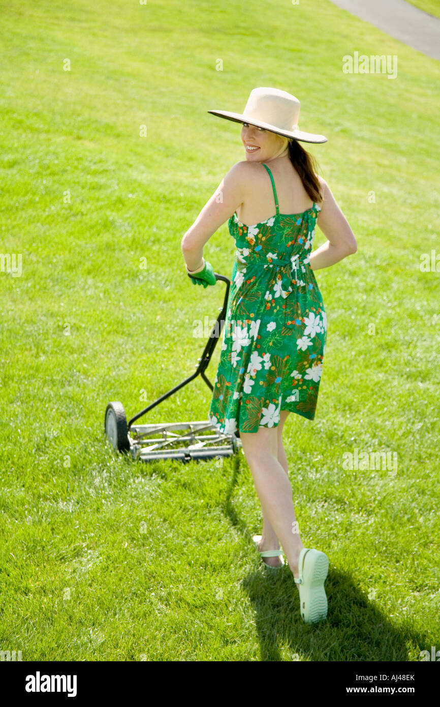 Woman Pushing Lawn Mower High Resolution Stock Photography and Images ...