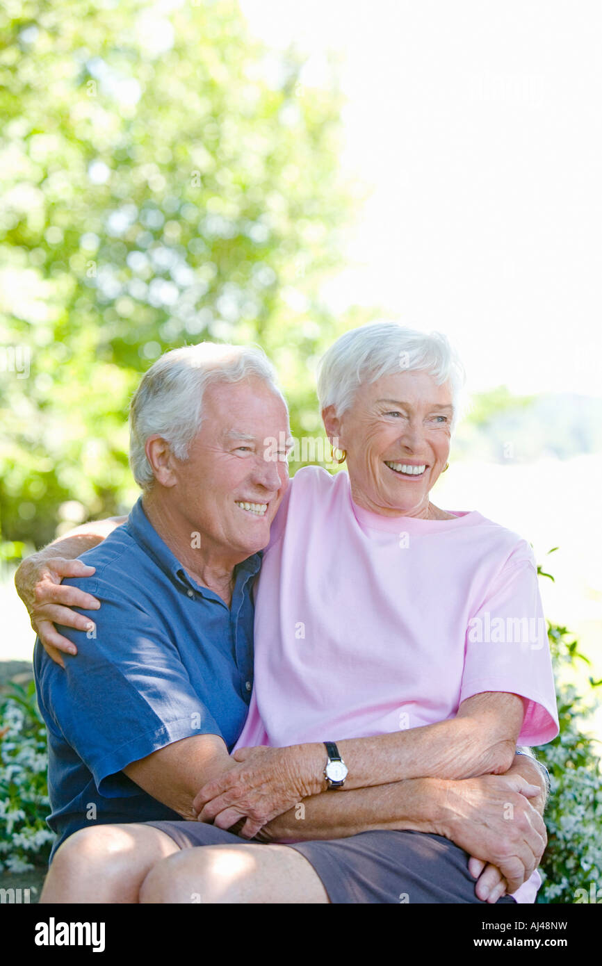 Senior couple hugging Stock Photo - Alamy