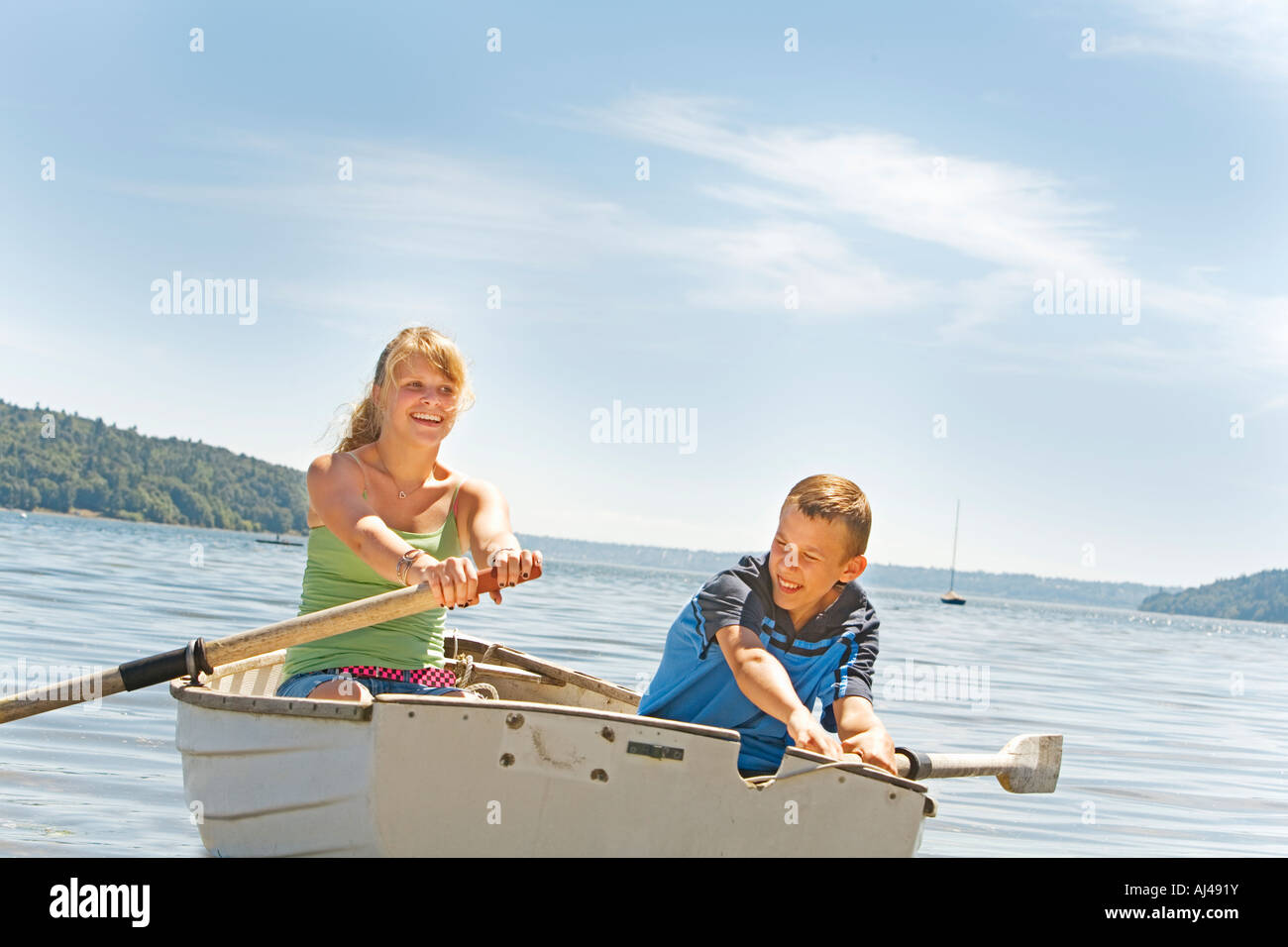 Boy and girl in row boat Stock Photo - Alamy