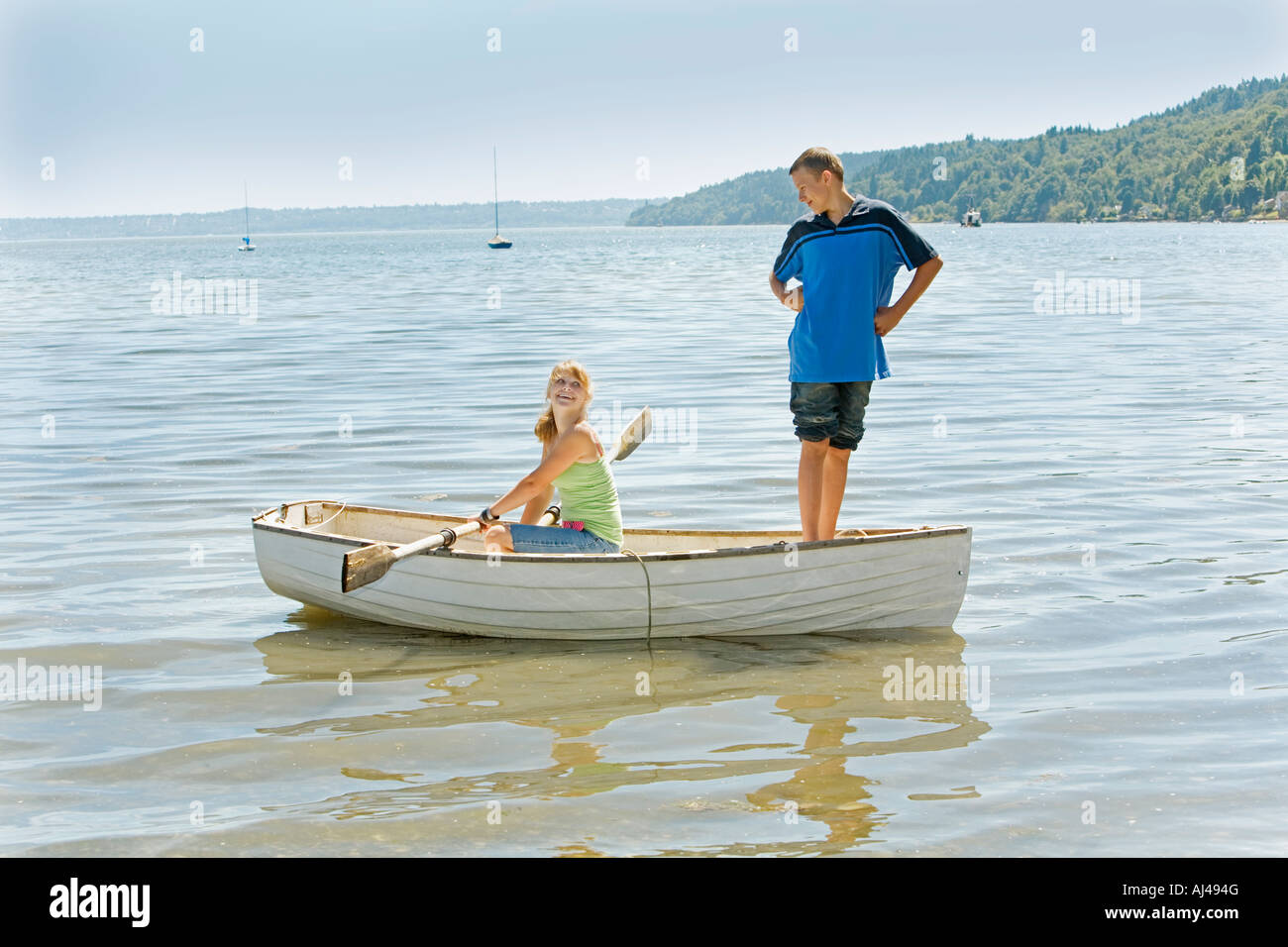 Boy and girl in row boat Stock Photo - Alamy