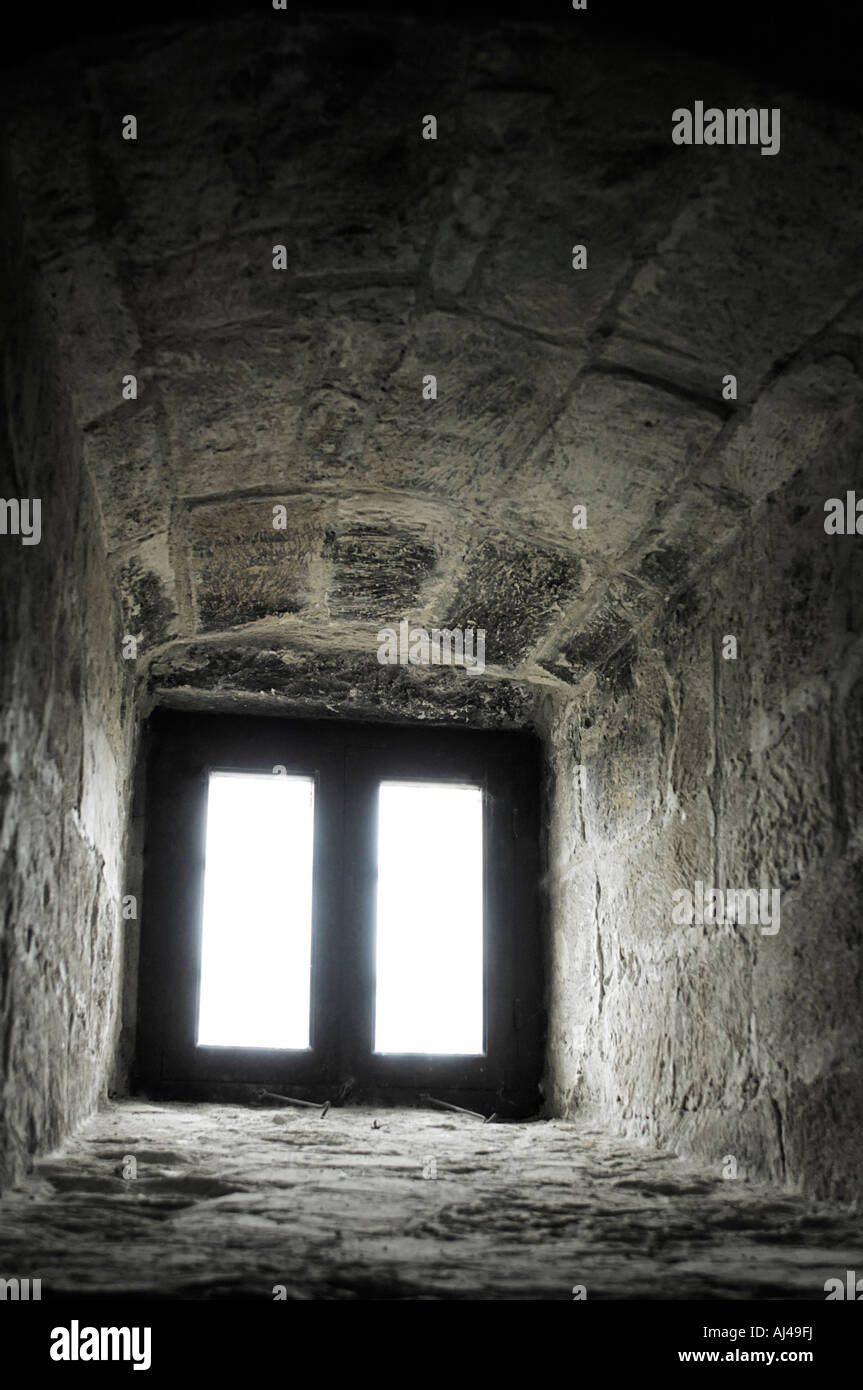 Light coming from a small window Stock Photo - Alamy