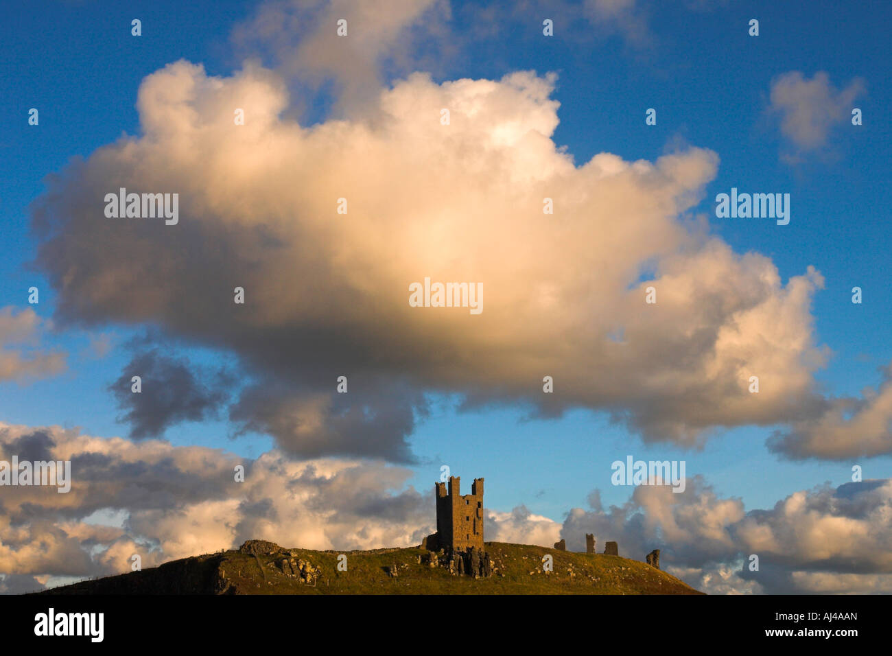 Spectacular clouds above Lilburn Tower part of Dunstanburgh Castle ...