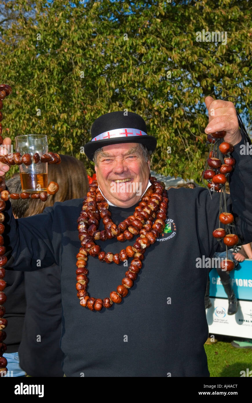 King Conker David Jakins displaying a string of conkers Stock Photo - Alamy