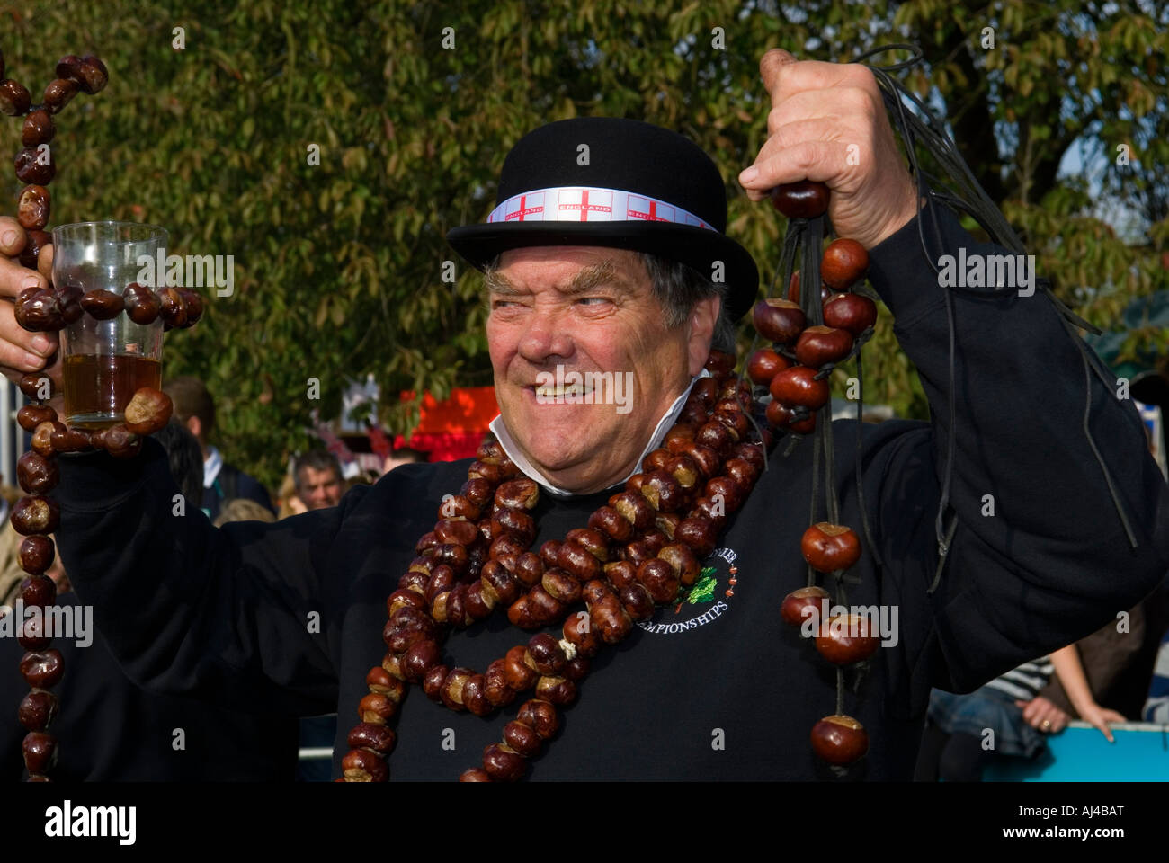 King Conker David Jakins displaying a string of conkers Stock Photo - Alamy