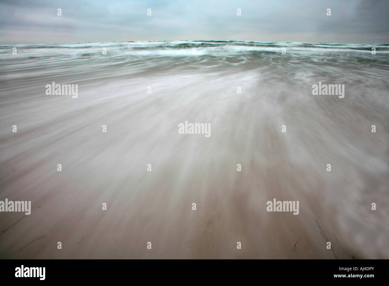 beach with surge Stock Photo - Alamy
