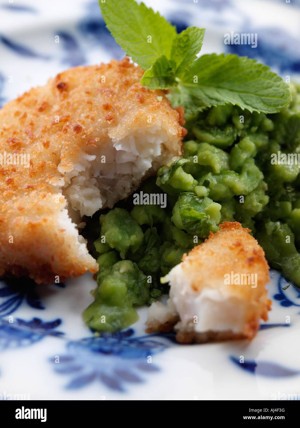 Fish cake and mushy peas Stock Photo - Alamy