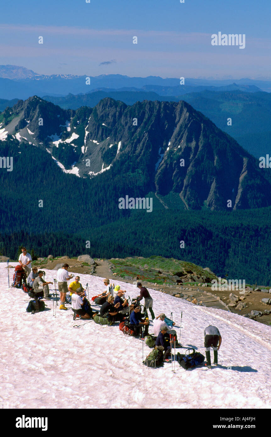 Hikers resting on the Trail to Camp Muir in Mount Rainier National Park ...