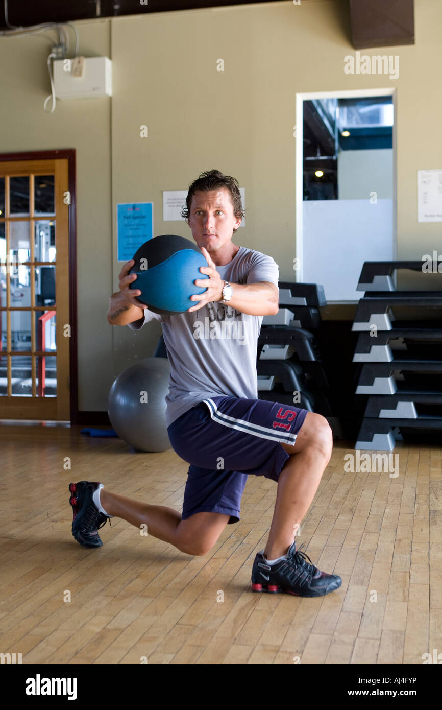 Fit male exercising in a gym Workout Stock Photo - Alamy