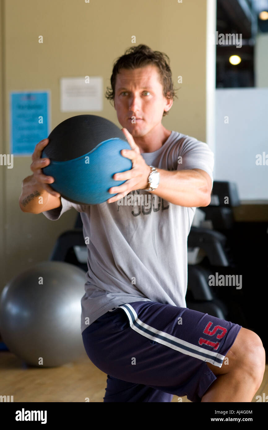 Fit male exercising in a gym Workout Stock Photo - Alamy