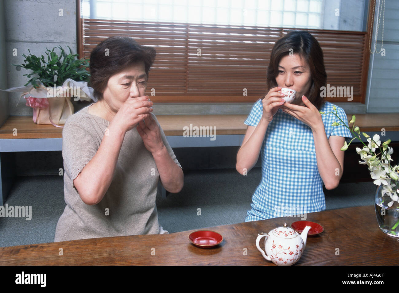 Two people drinking tea Stock Photo - Alamy