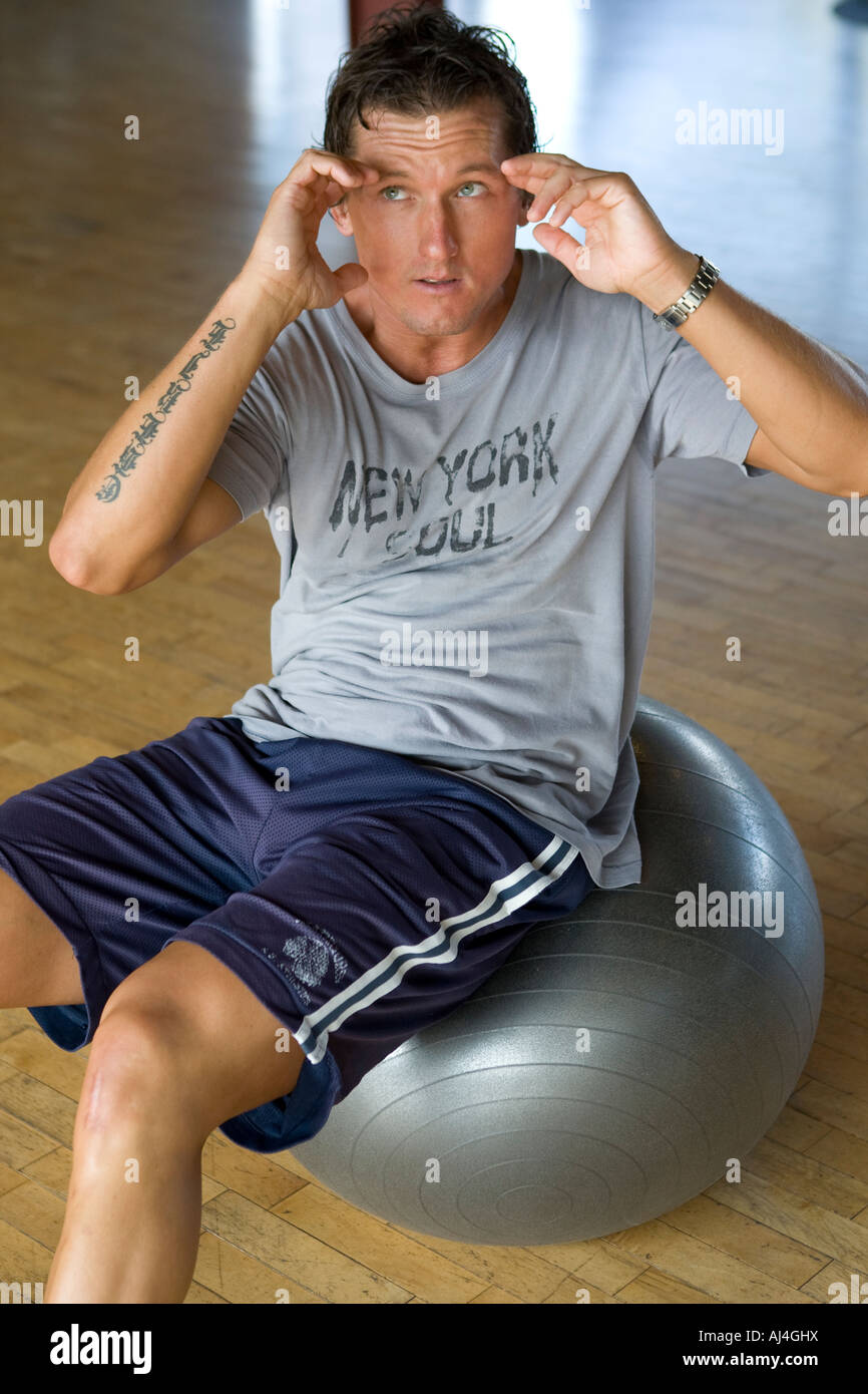 Fit male exercising in a gym Workout Stock Photo - Alamy