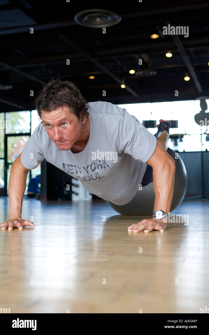 Fit male exercising in a gym Workout Stock Photo - Alamy