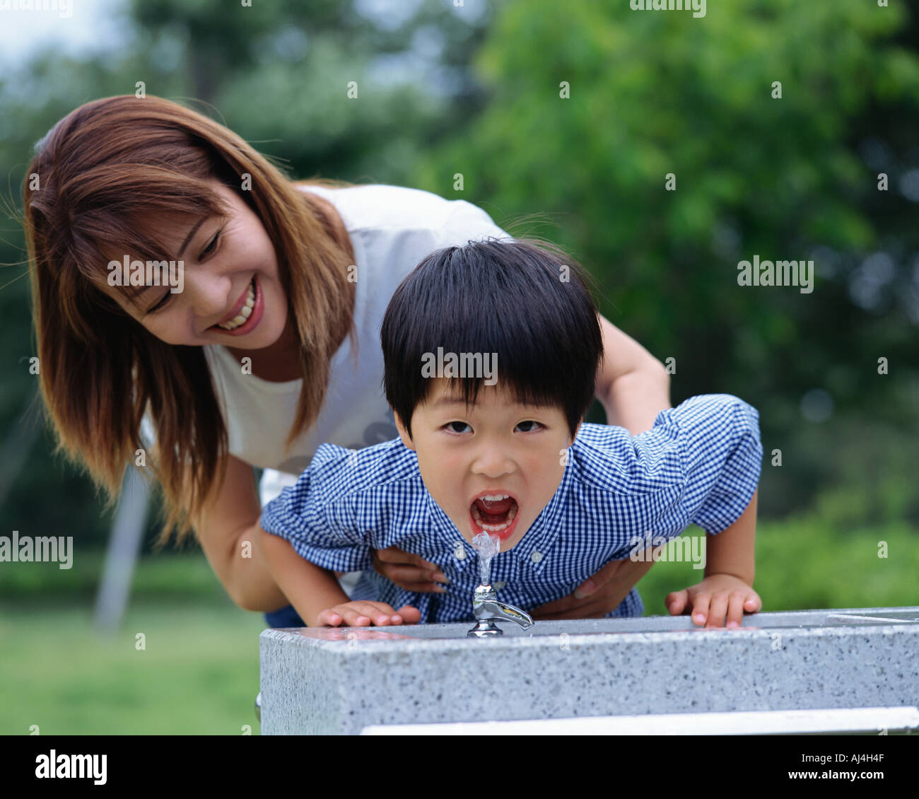 A boy drinking tap water Stock Photo - Alamy