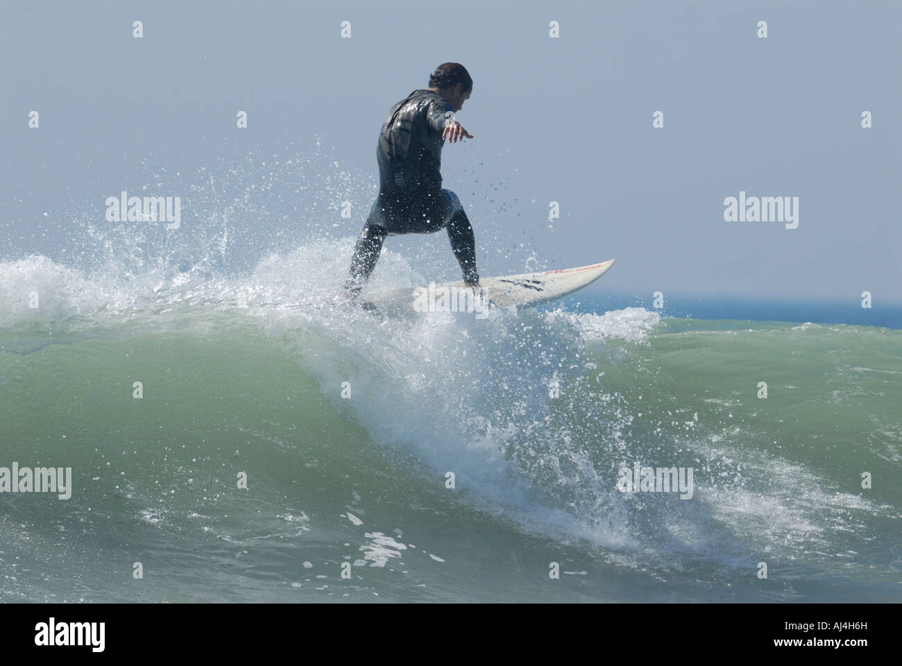 Surfer riding on top of wave Stock Photo - Alamy