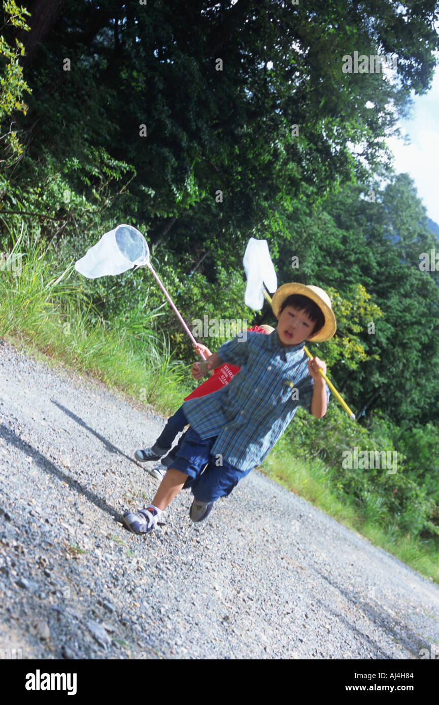 Children catching butterfly hi-res stock photography and images - Alamy