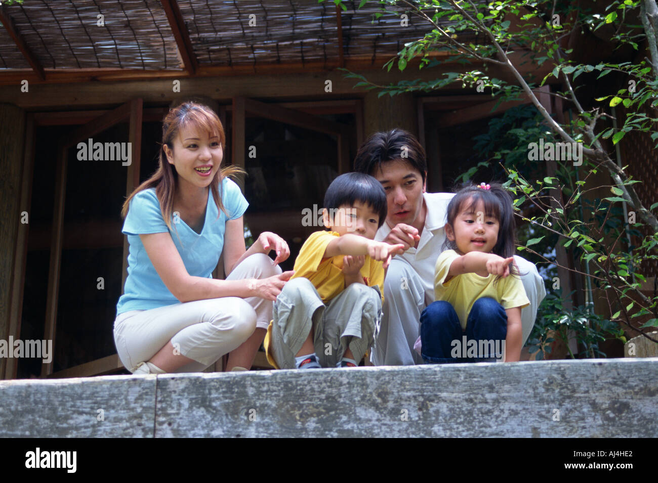 Woman sitting outside log cabin hi-res stock photography and images - Alamy