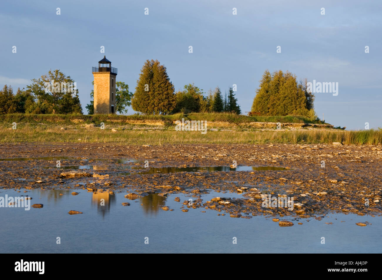 Peninsula Point Lighthouse and Reflection on Lake Michigan Near ...