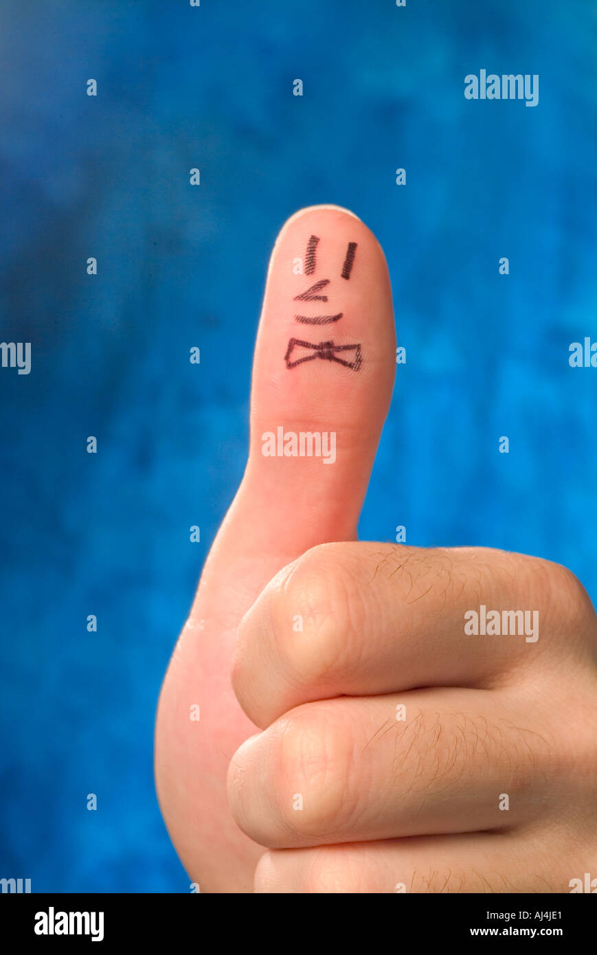 Thumb with Face of Businessman Stock Photo - Alamy