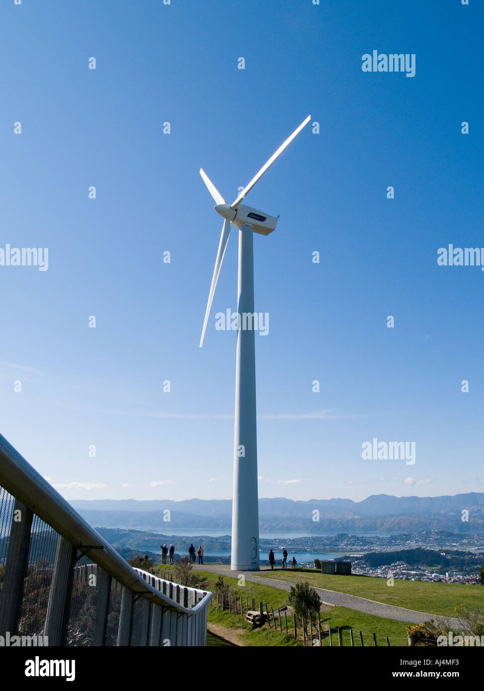 Renewable energy wind turbine with people underneath Stock Photo - Alamy