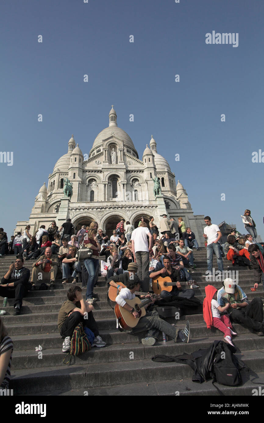 Sacre Coeur Montmartre Paris France tourists sitting on steps Stock ...