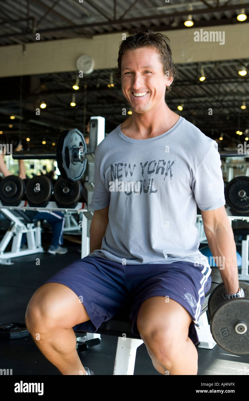 Fit male exercising in a gym Workout Stock Photo - Alamy