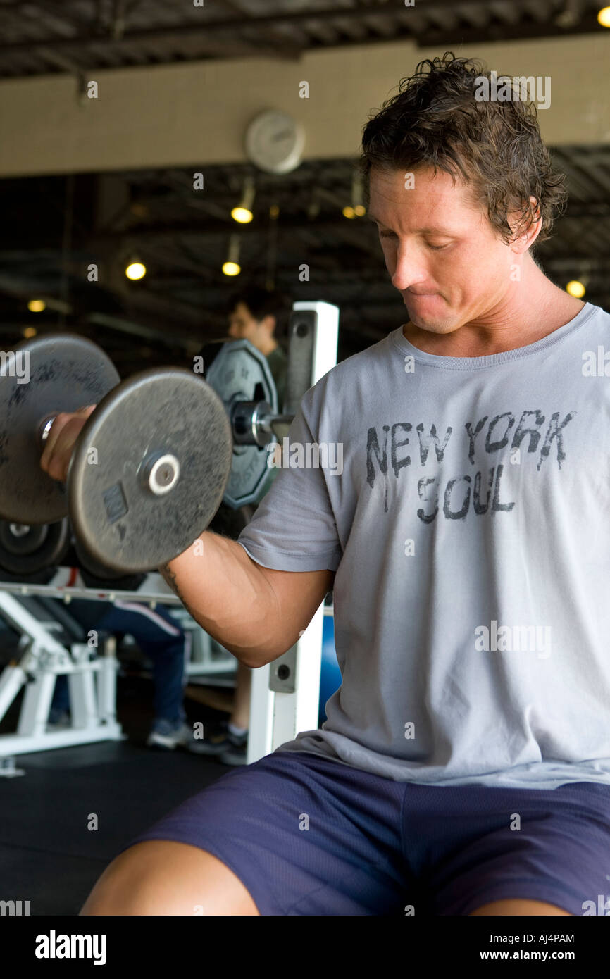 Fit male exercising in a gym Workout Stock Photo - Alamy