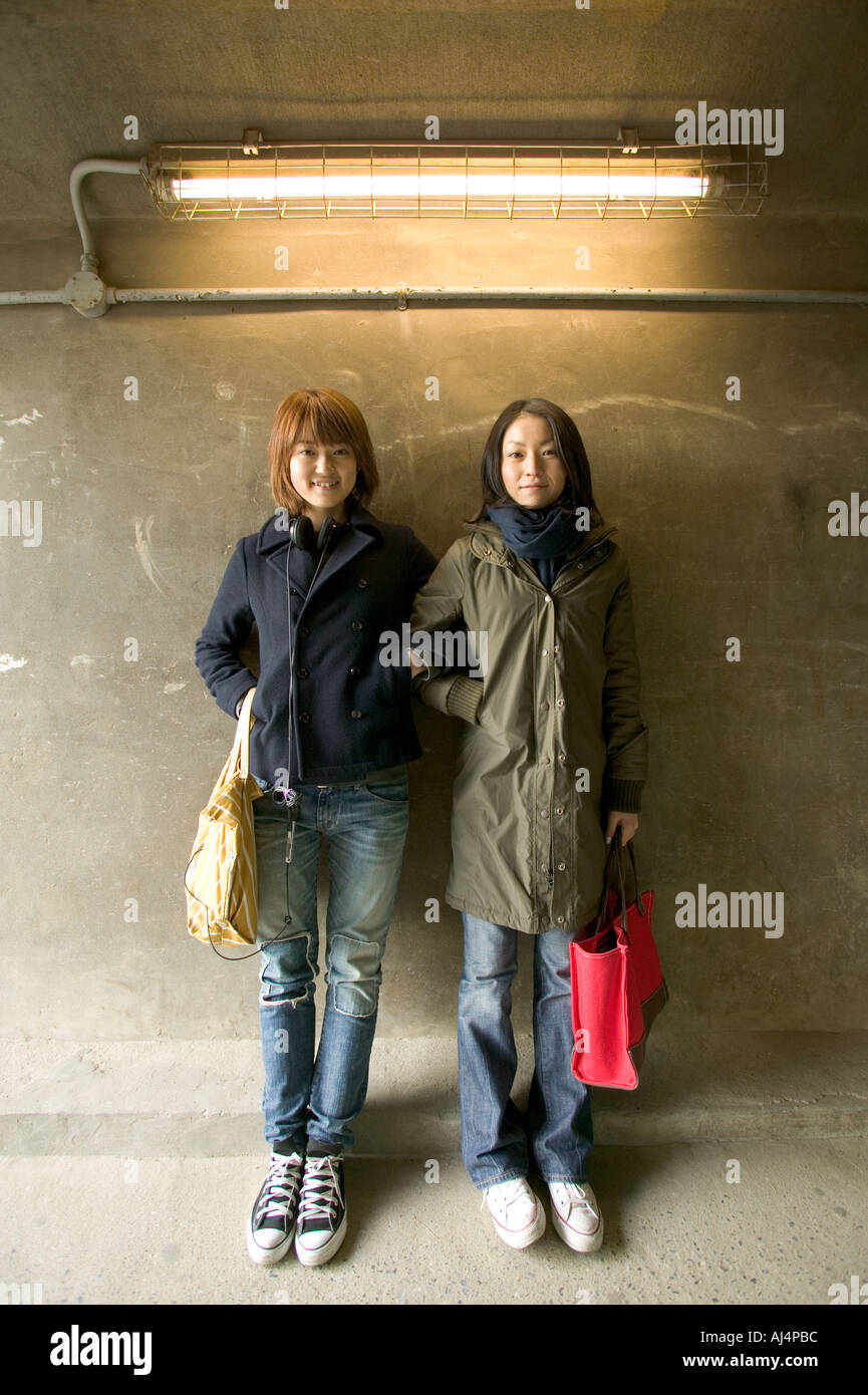 Two college students standing Stock Photo - Alamy