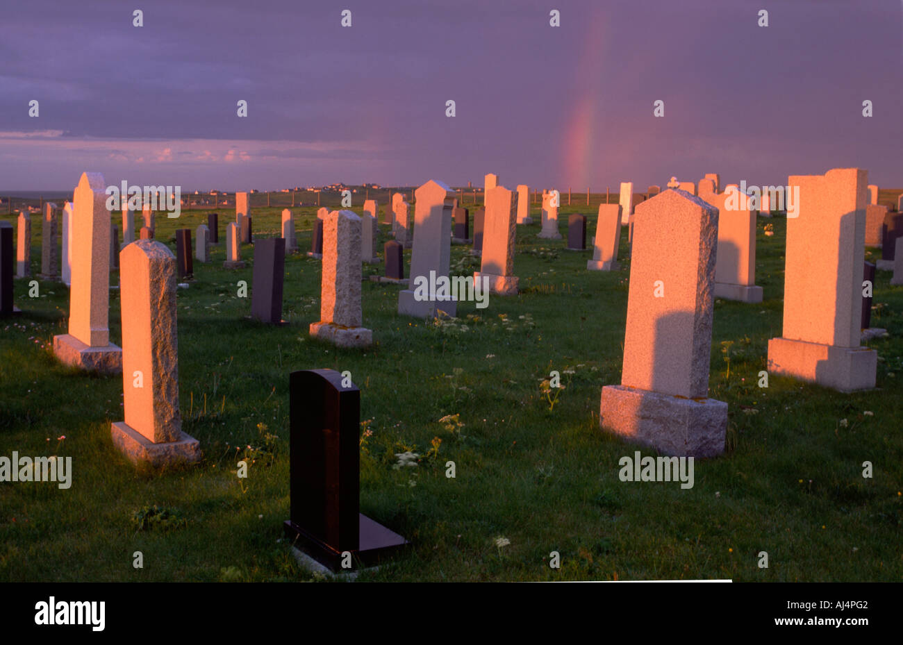 A rainbow lights the evening sky above the cemetery at Habost on the ...