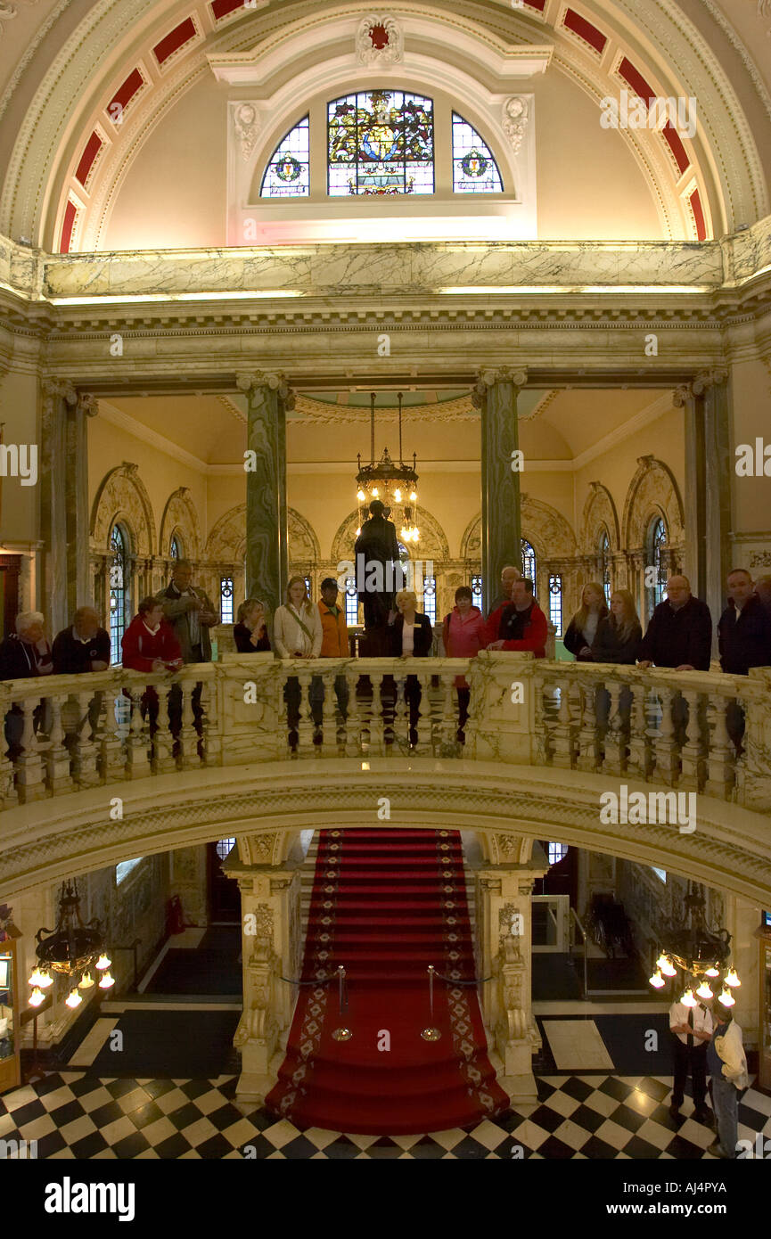 tourists standing in the rotunda area during a tour of belfast city ...