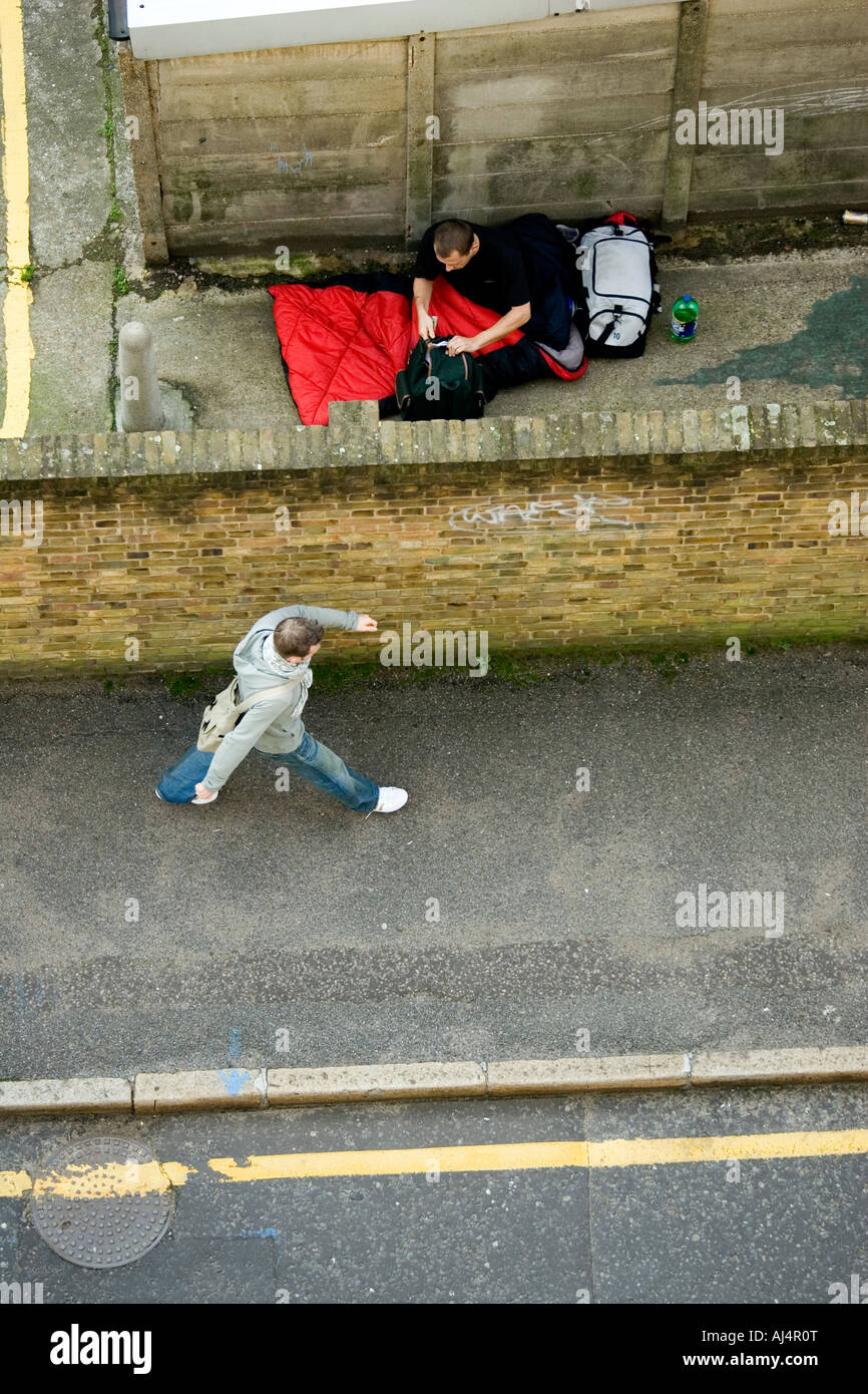 Man hiding from public view in the street of London, England, Britain ...