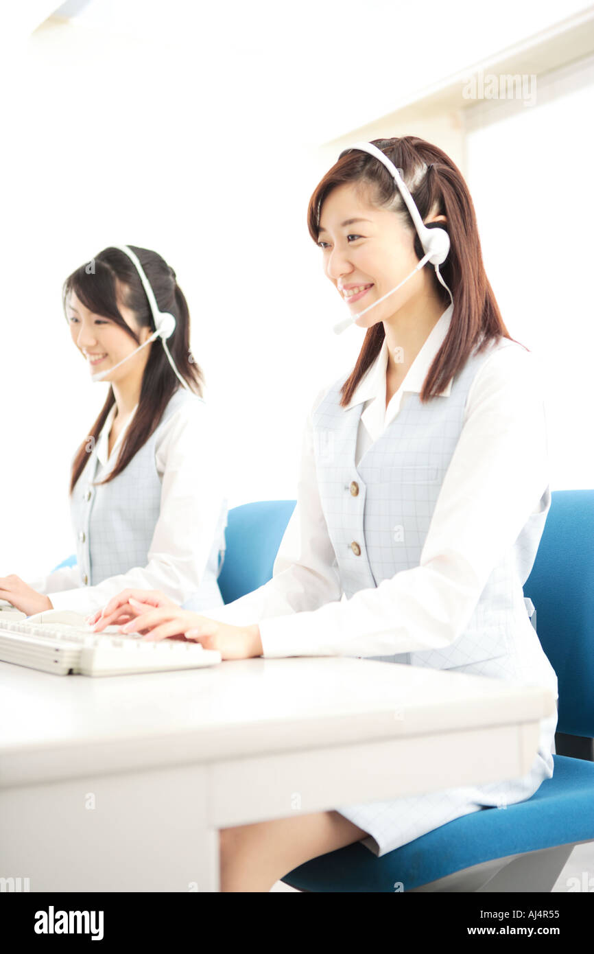 Two business people wearing headsets hi-res stock photography and ...