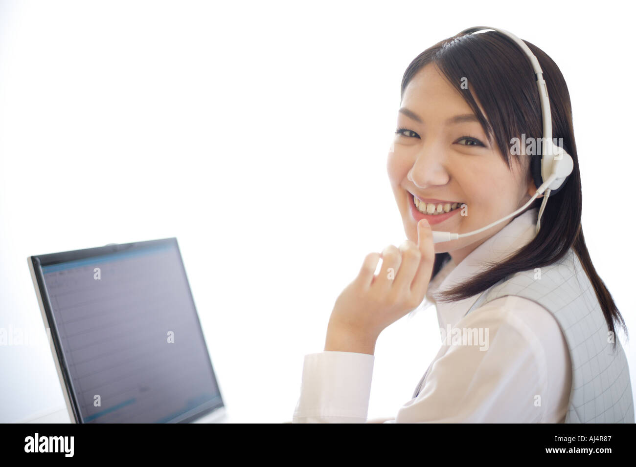 Young woman wearing headset Stock Photo - Alamy