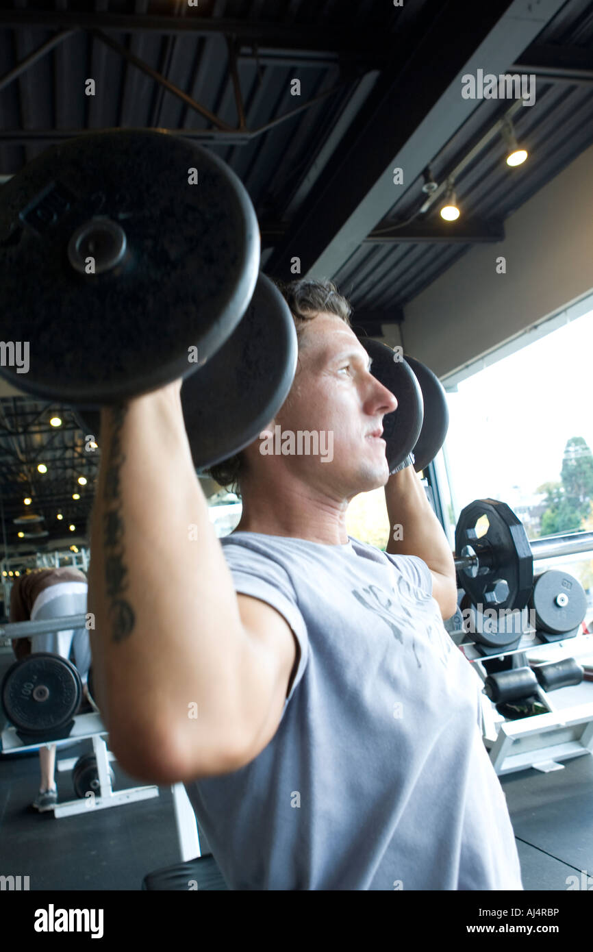 Fit male exercising in a gym Workout Stock Photo - Alamy
