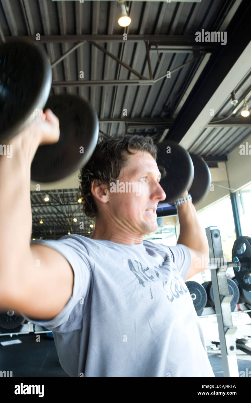 Fit male exercising in a gym Workout Stock Photo - Alamy