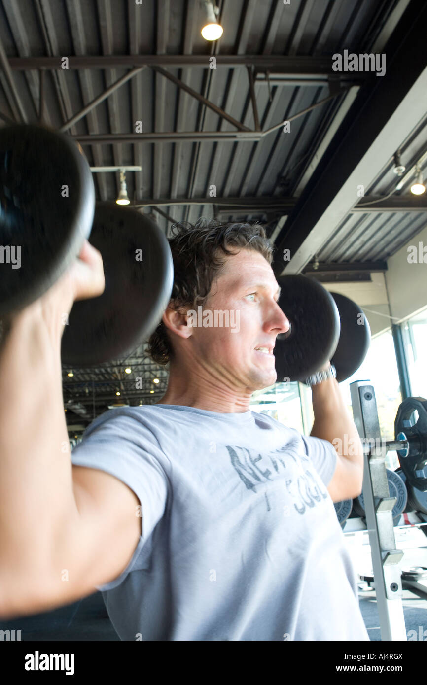 Fit male exercising in a gym Workout Stock Photo - Alamy